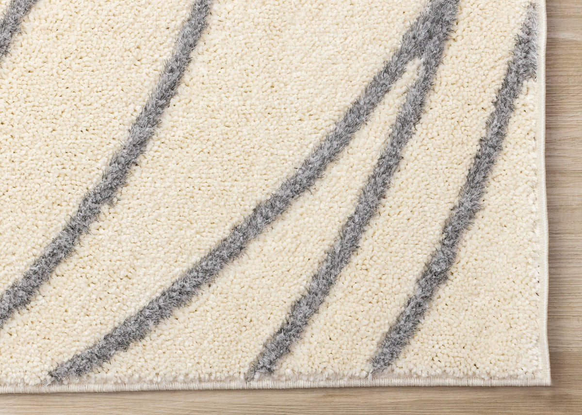 Sully 5'3" x 7'7" Circle Swirl Area Rug - Cream | Leon's