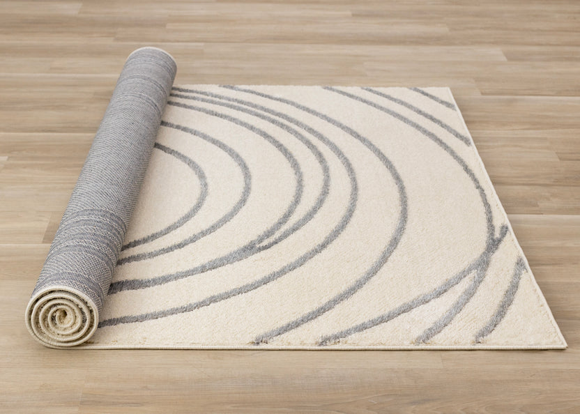 Sully 5'3" x 7'7" Circle Swirl Area Rug - Cream | Leon's